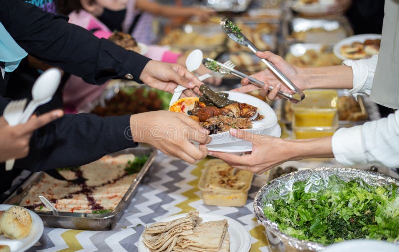 Selective of Hands Taking Food from a Buffet during Hari Raya Stock ...