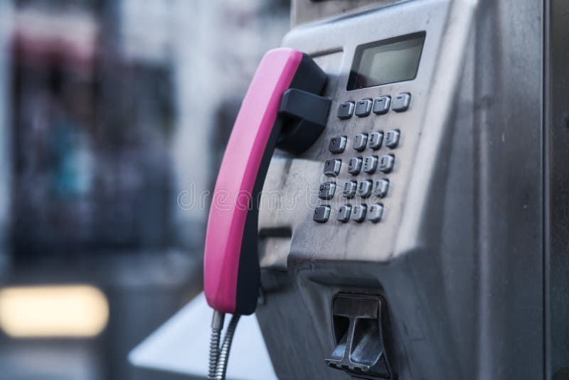 Selective Shot of a Pink Payphone in City Street Stock Photo - Image of ...
