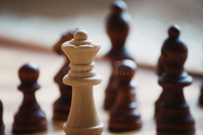 Selective Shot of a Queen Chess Figure Standing in Front of the Black ...