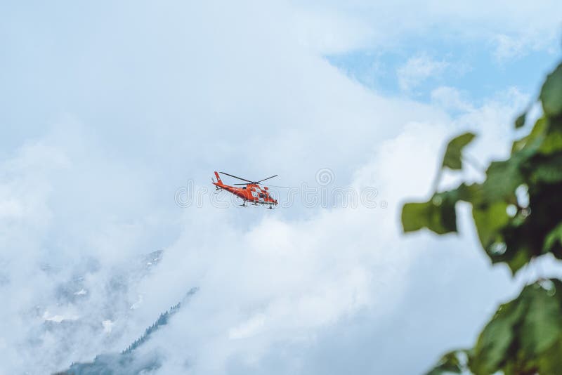 Selective Shot of a Red Helicopter, Flying in the Blue Sky Stock Image ...