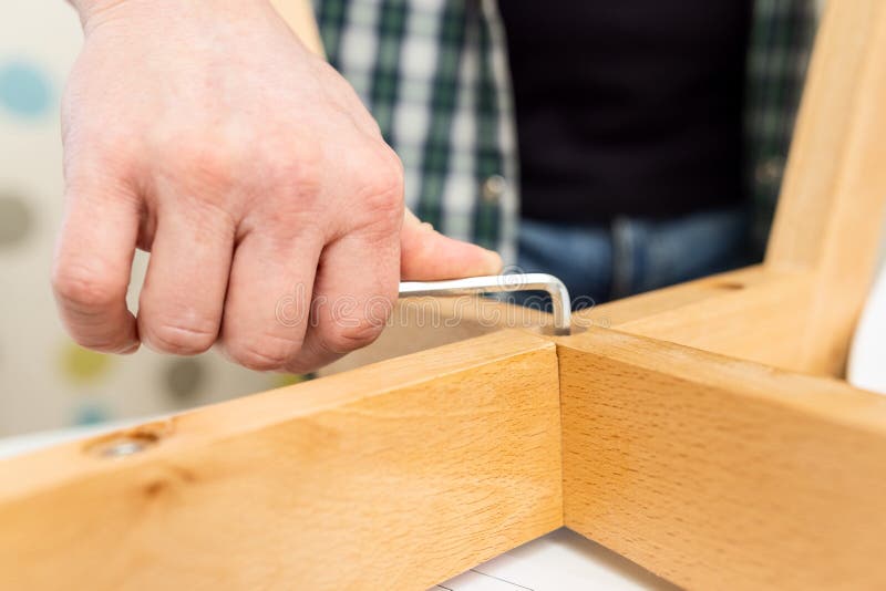 Self Assembly Furniture Concept The Young Man Himself Assembling Chairs Stock Image Image Of