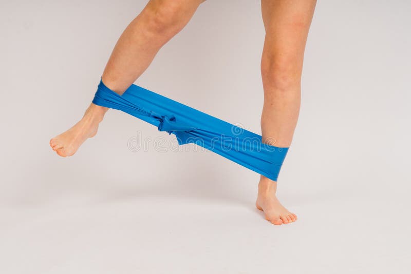 Self Determined Bodybuilder Does Exercises with Rubber Band, Works on ...