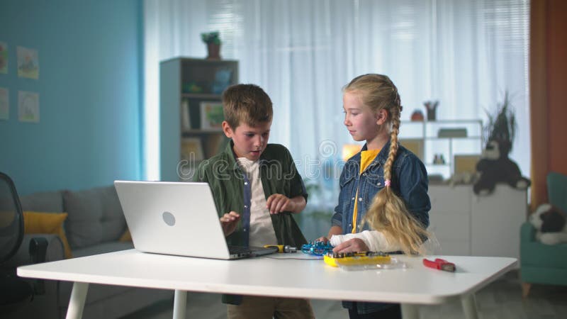 Children Study the Work of Mini Pocket Quadcopter Connected To Laptop ...