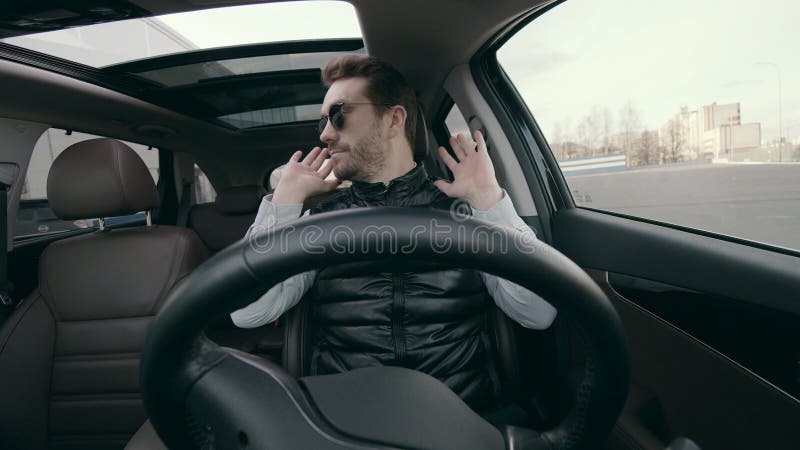 Self-driving Autonomous Car is Parking by Itself. a Man is Smiling ...