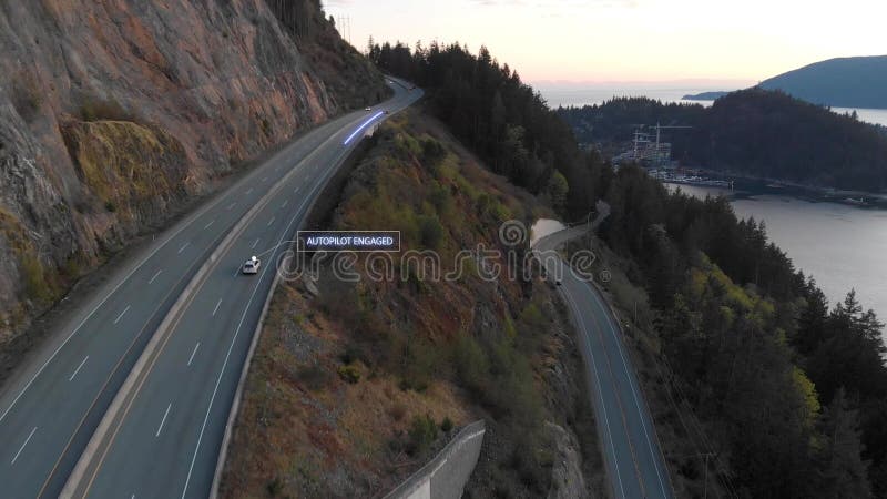 A Self Driving Car Travelling Down a Beautiful Coastal Highway with a ...