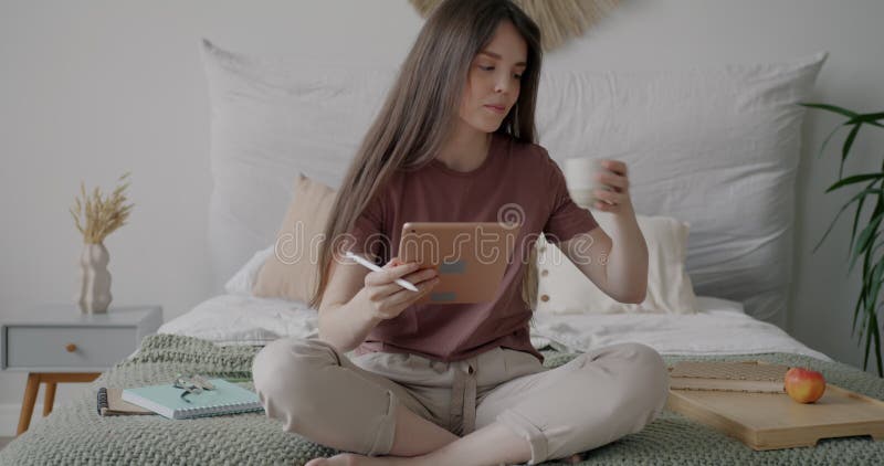 Self-employed Digital Artist Drawing with Graphics Tablet and Drinking ...