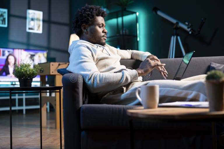 Self Employed Man Inputting Data on Laptop while Working from Home ...