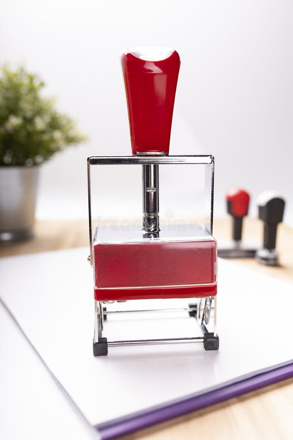 A Self-inking, Rubber Date Stamp. Paperwork. a Composition of Office ...