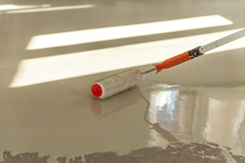 Self-leveling Epoxy. Leveling with a Mixture of Cement Floors Stock ...