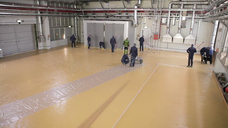 Self-leveling Floor in the Workshop. Builders Make a Self-leveling ...