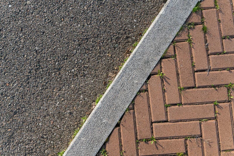 Self-locking Bricks and Asphalt Road Junction. Functional and Weather-resistant Material. Self ...