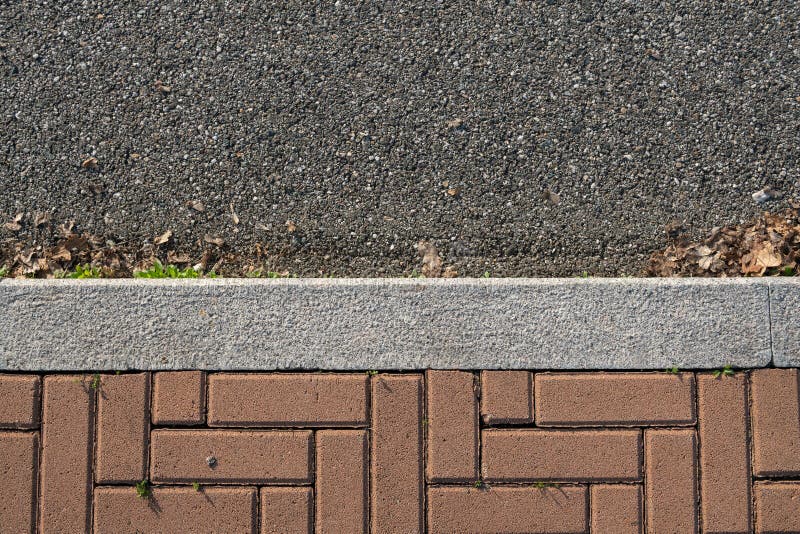 Self-locking Bricks and Asphalt Road Junction. Functional and Weather ...