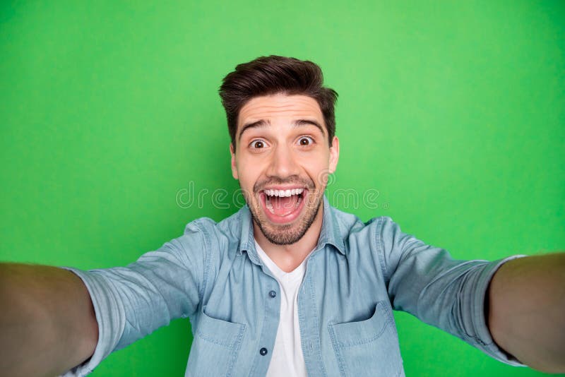 Self Portrait Of Cheerful Positive Handsome Man Taking Selfie Having