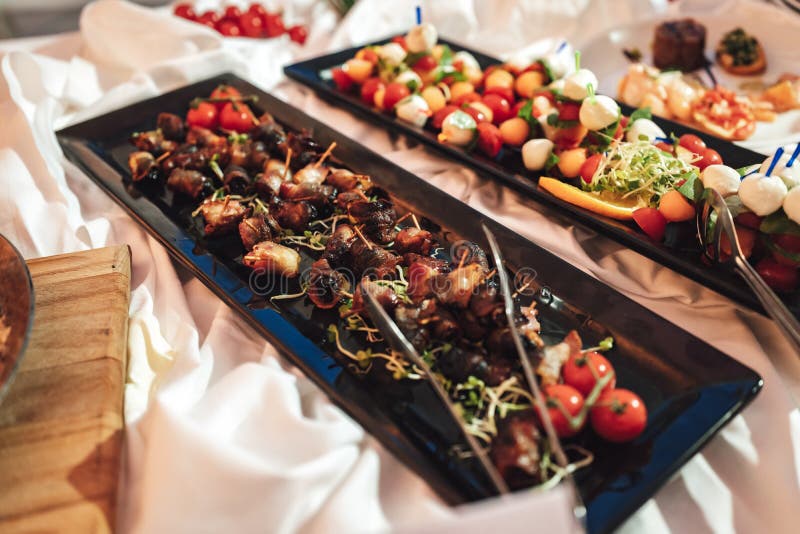 Self-service Buffet Table with Various Types of Small Snacks. Focused ...