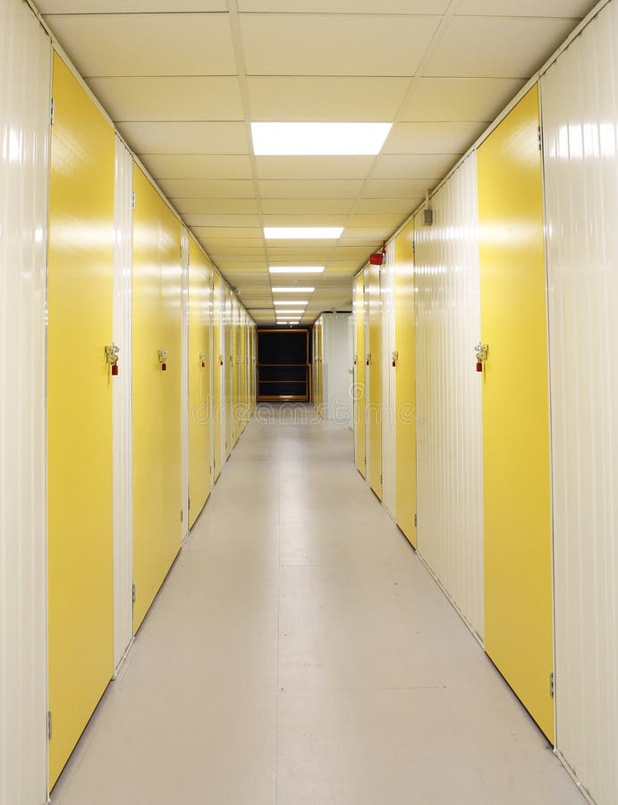 Self Storage Corridor with Yellow Doors Stock Image - Image of moving ...