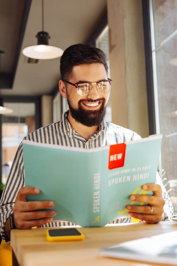 Positive Bearded Man Studying a New Language by Himself Stock Image ...