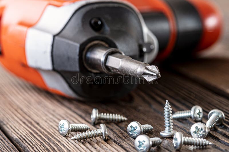 Self-tapping Screws on the Background of a Screwdriver, Fasteners for ...