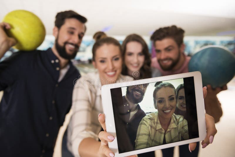 One Last Selfie. a Group of Business Colleagues Taking Selfies with a ...