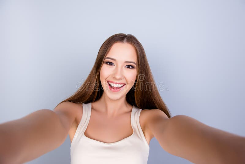 Selfie Mania Cute Young Girl With A Beaming Smile Is Taking A S Stock