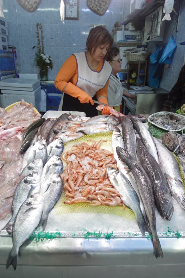 Seller at fish market editorial stock photo. Image of animal - 23795078