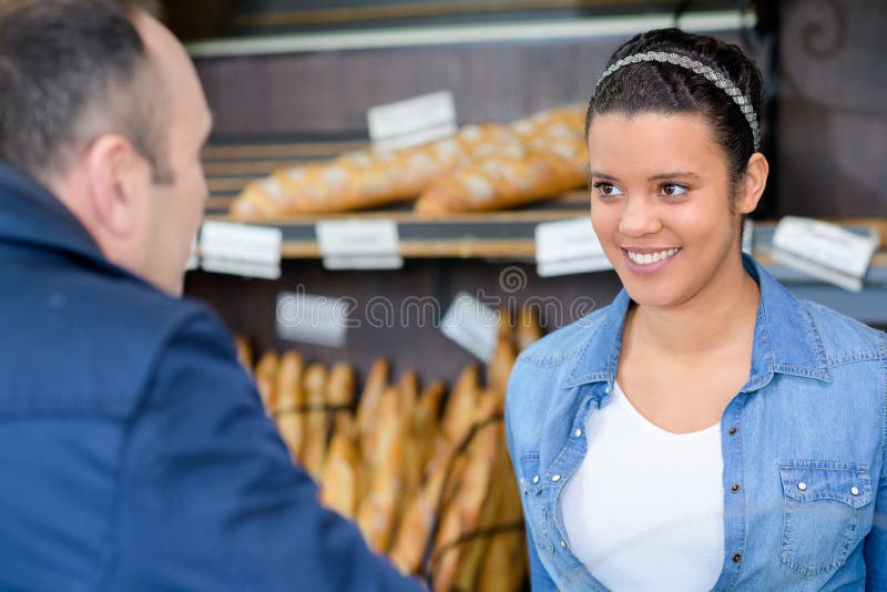 Seller Interacting with Customer in Bakery Stock Photo - Image of woman ...