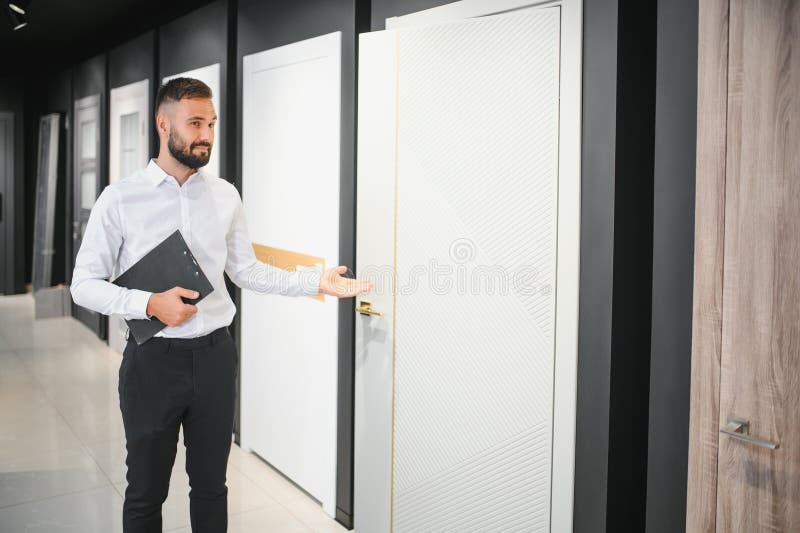 A Seller of Interior Doors in a Hardware Store Stock Photo - Image of ...