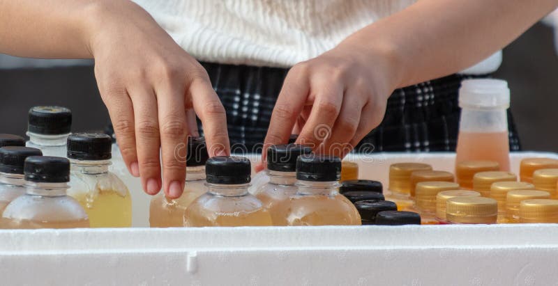 The Seller Sells Cold Drinks. Close-up of a Hand Stock Image - Image of ...