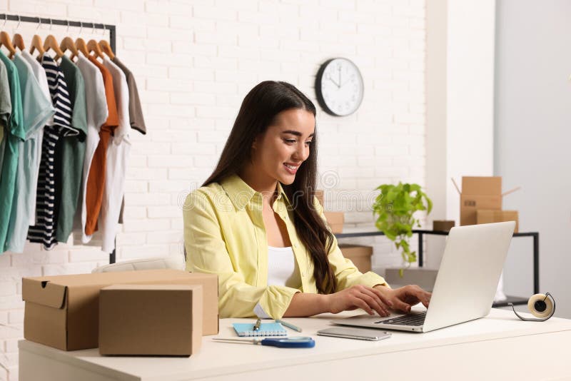 Seller Working with Laptop at Table in Office. Online Store Stock Photo ...