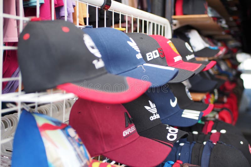 Selling cap at the market editorial stock image. Image of style - 174012774