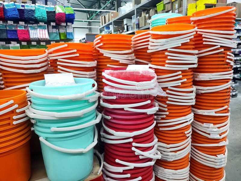 Selling a Lot of Plastic Multi-colored Buckets in a Department Store ...