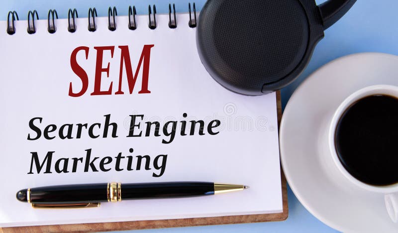 SEM - Words in a White Notepad on a Light Background with a Cup of ...