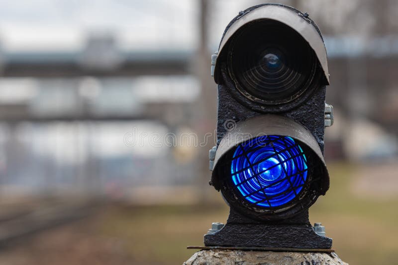 Semaphore with Burning Blue Light. the Intersection of Railway Tracks ...