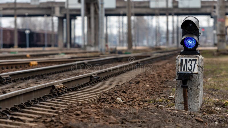 Semaphore with Burning Blue Light. the Intersection of Railway Tracks ...