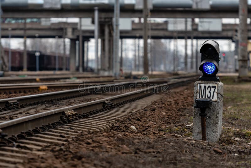 Semaphore with Burning Blue Light. the Intersection of Railway Tracks ...