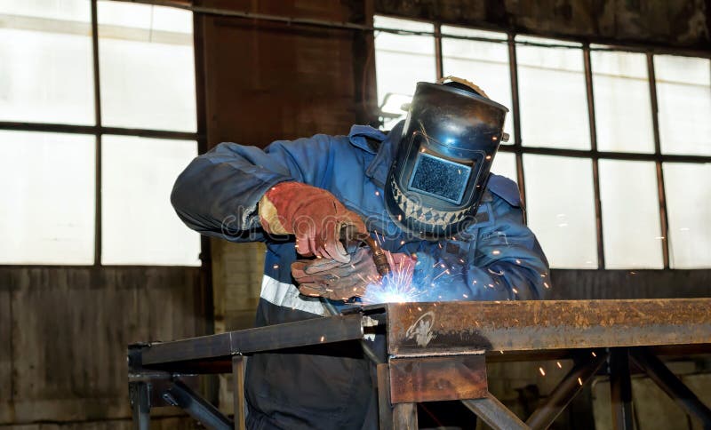 Semi-automatic Welding of Metal Structures in the Shop Stock Photo ...