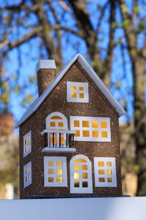 On a Semi-blurred Background of Trees, a Brown Two-story House with ...