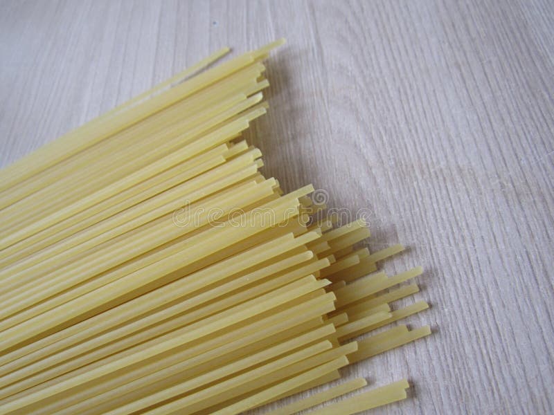 Semi-finished Pasta Spaghetti on Brown Table Surface Stock Photo ...