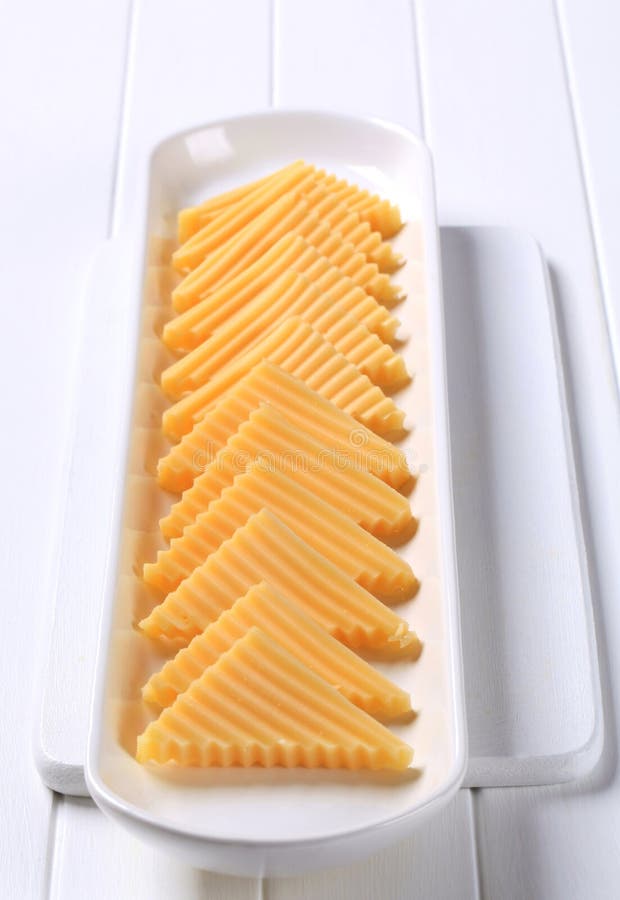 Semi-hard cheese triangles stock photo. Image of gouda - 30874820