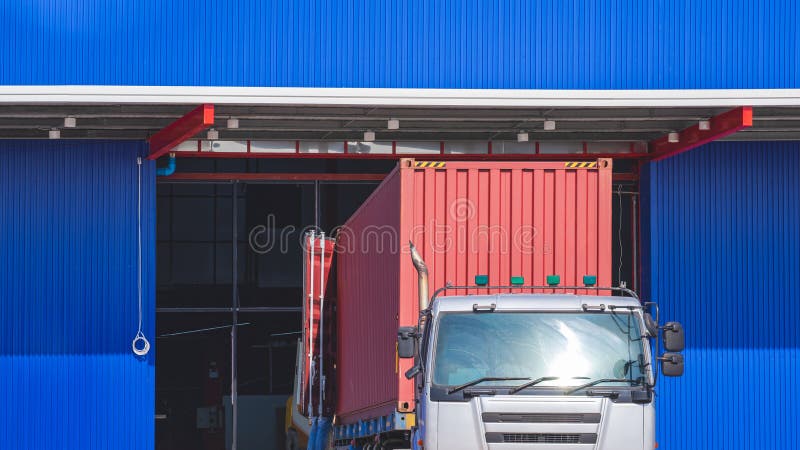 Semi Trailer Truck is Being Unloading Construction Equipment into New ...