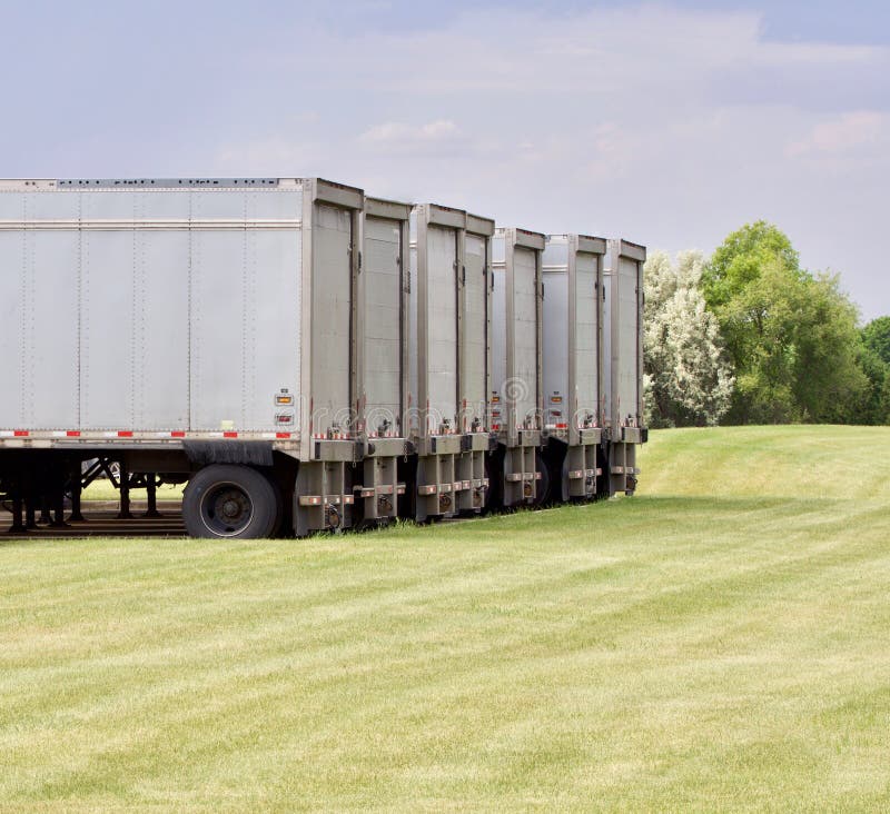Semi Trailers Waiting Loading and Unloading in the Dock of Warehouse ...