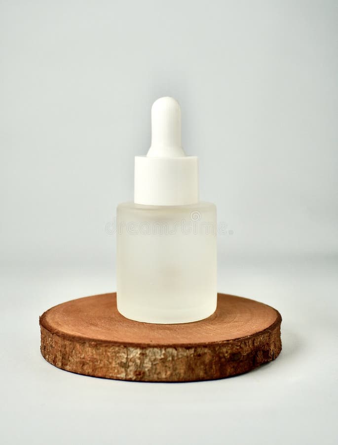 Semi Transparent Skin Care Container on Wooden Coaster Stock Photo ...