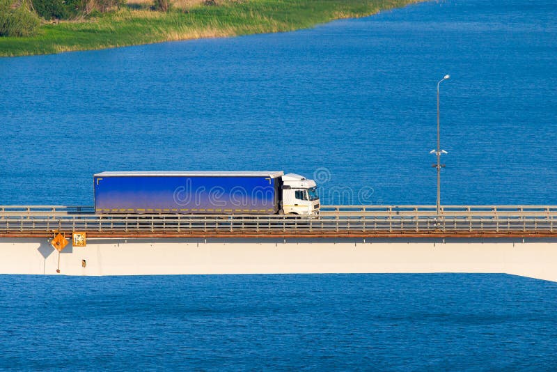 Semi-truck with Cargo Trailer Driving on a Bridge Stock Image - Image ...