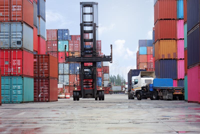 Semi-trucks and Container Lifters in the Container Yard Stock Image ...