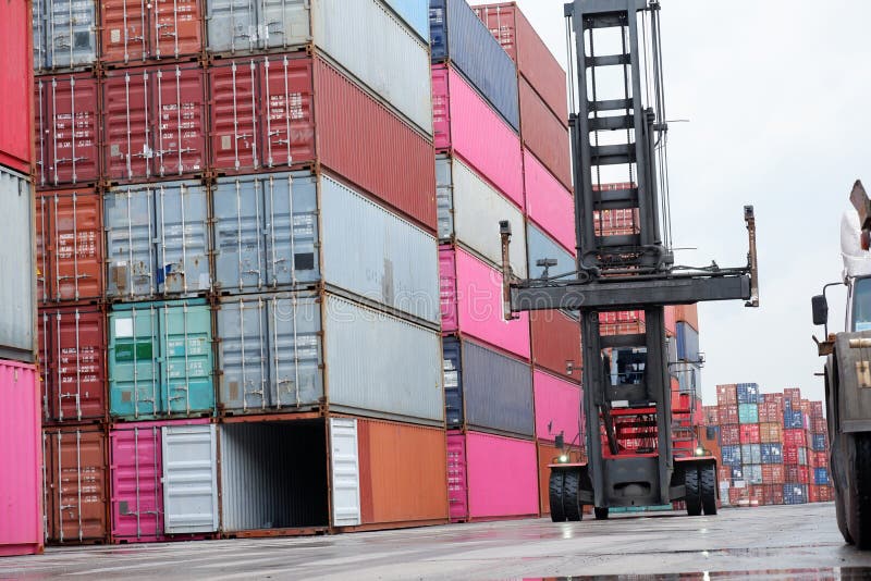 Semi-trucks and Container Lifters in the Container Yard Stock Photo ...
