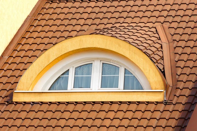 Semicircular, Arched Attic Window in the Background of the Brown Roof ...