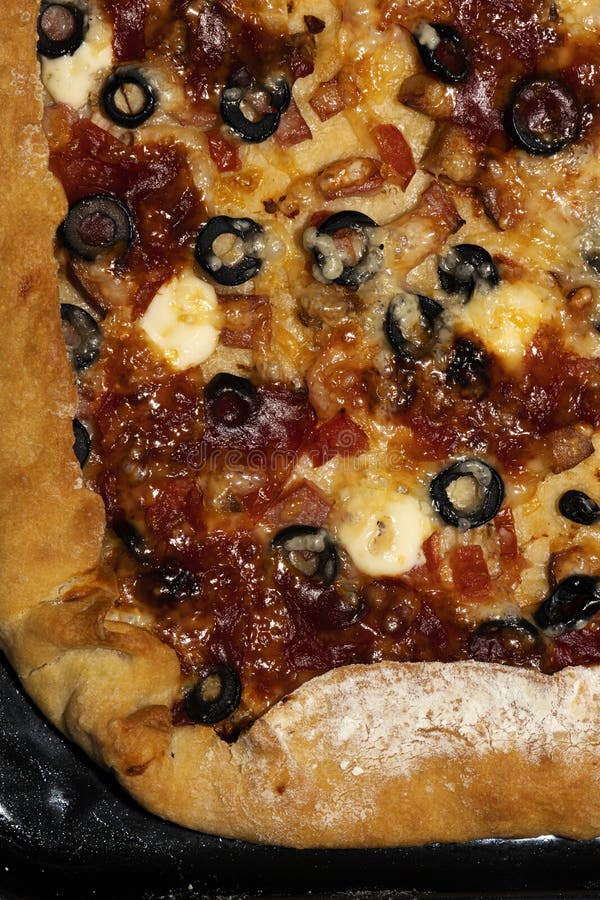 Semicircular Slice of Pizza on a Baking Sheet Left Side Stock Image ...