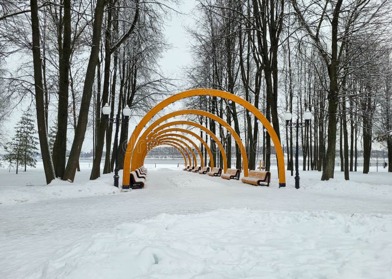Semicircular Wooden Arcade with Lamps in the Park in Winter Stock Photo ...