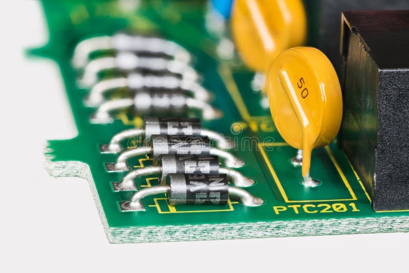 Semiconductor Diodes and Yellow Resettable Fuses in PCB Detail on White ...