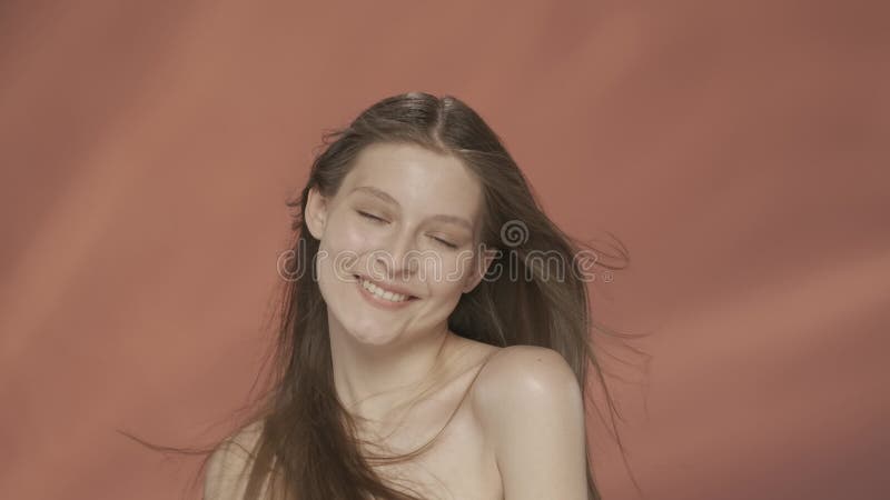 A Seminude Woman With Regular Features Touches The Clean Moisturized