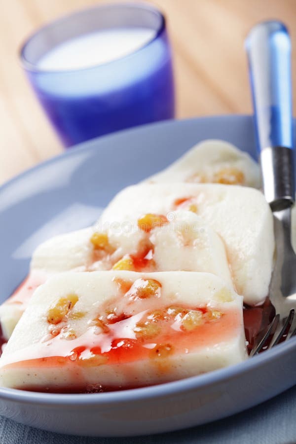 Semolina Pudding with Raisins Stock Photo - Image of pudding, sauce ...